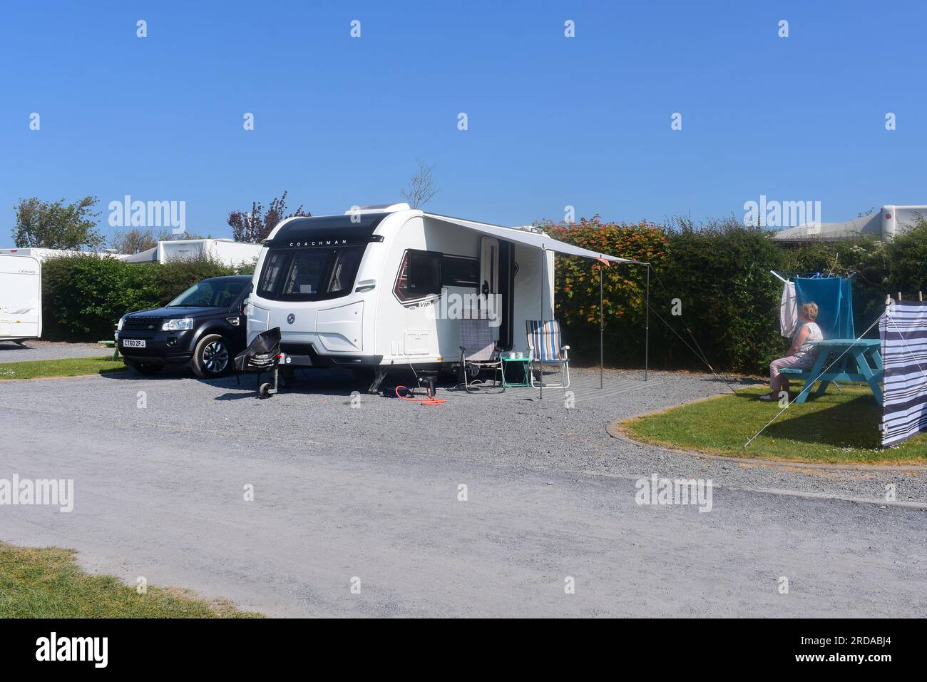 A modern car and caravan outfit on a fully serviced pitch at the Little ...
