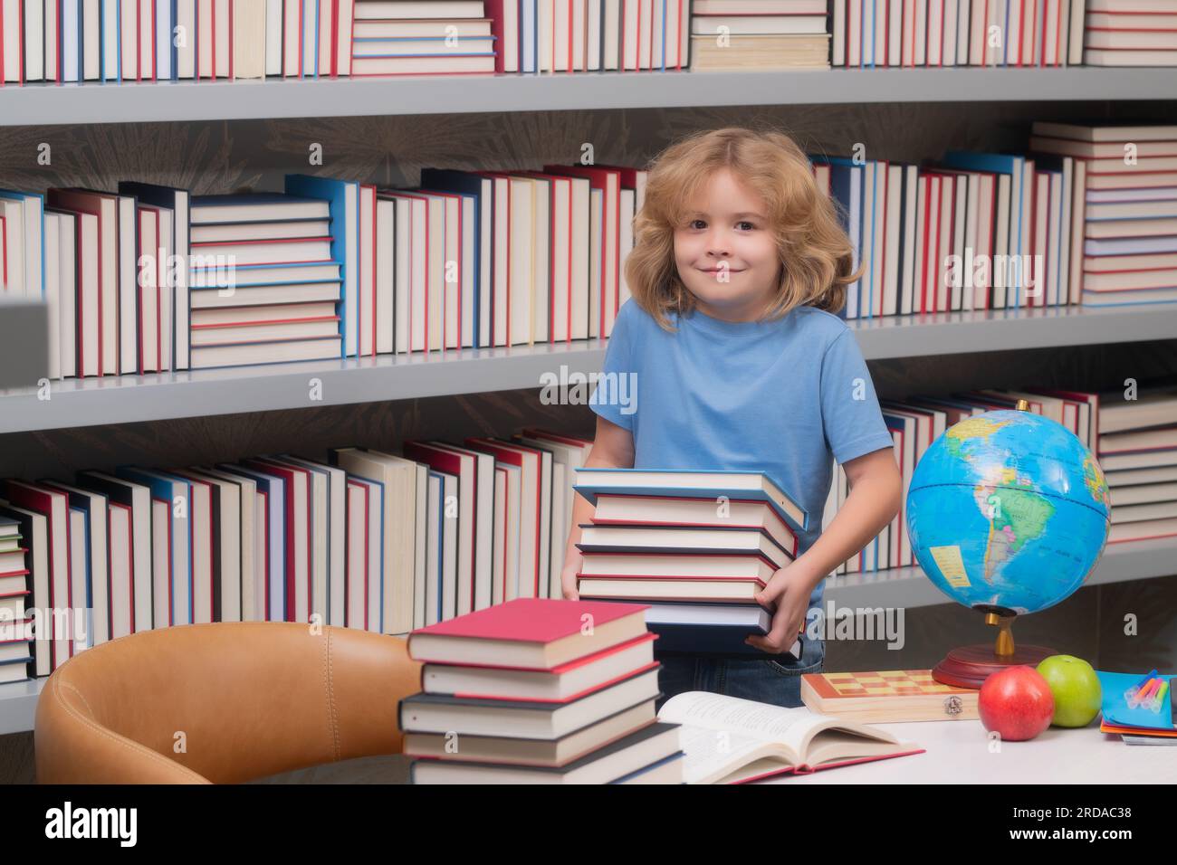 School boy with stack of books in library. School kid student learning ...