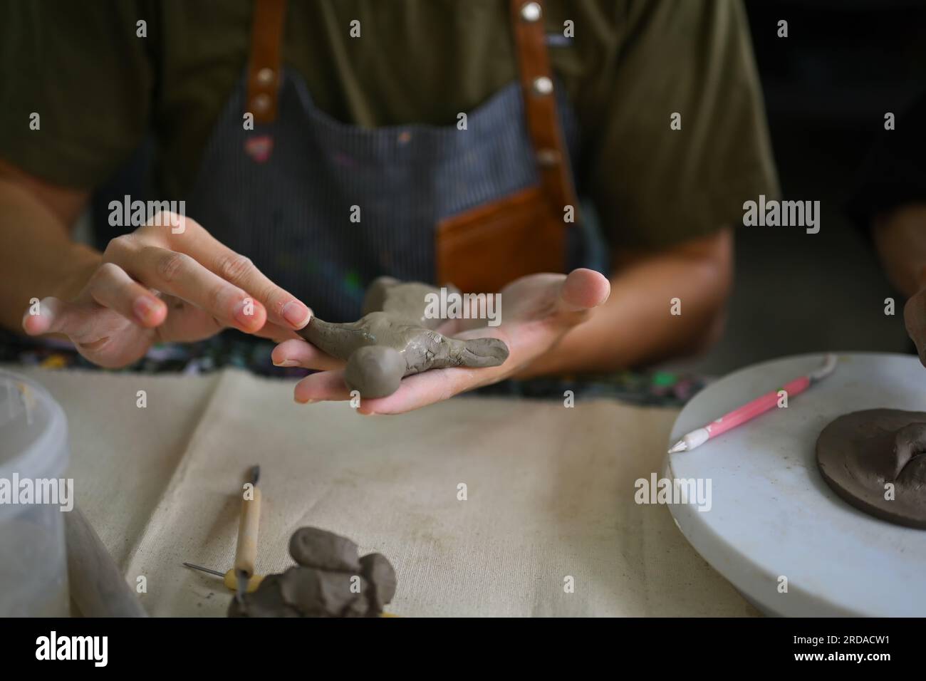 Image of young asian man enjoying creative process, creating handmade ...