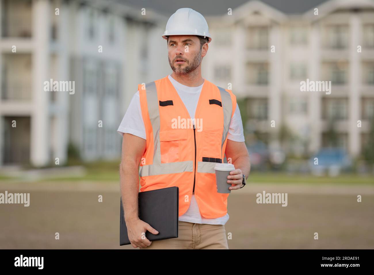Construction man in helmet build new house. Engineer work in builder ...