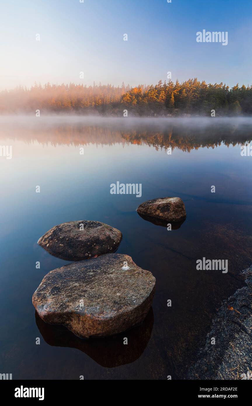 Still lake coast stones hi-res stock photography and images - Alamy