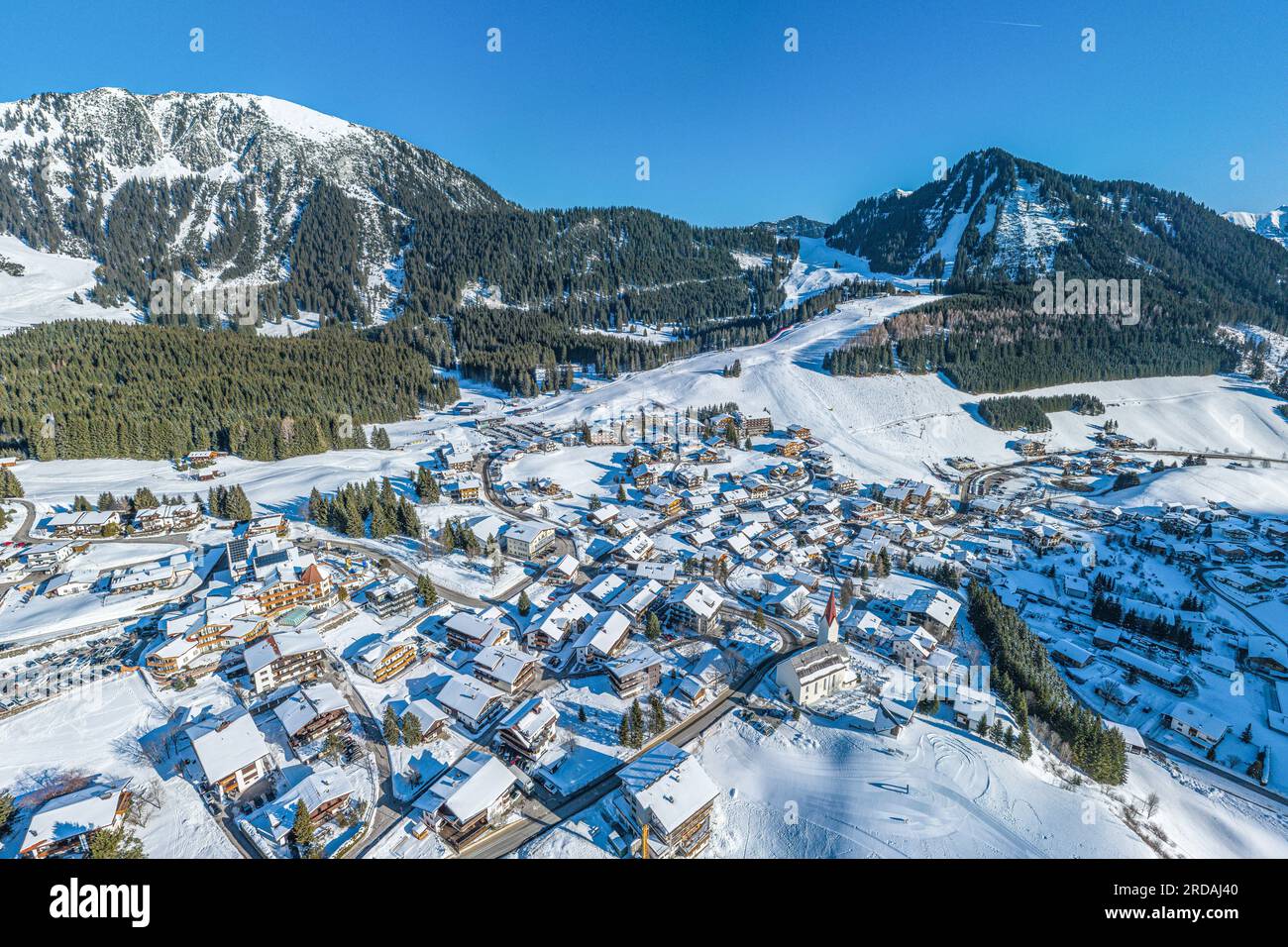Aerial view to the wintry village Berwang in the touristic region ...