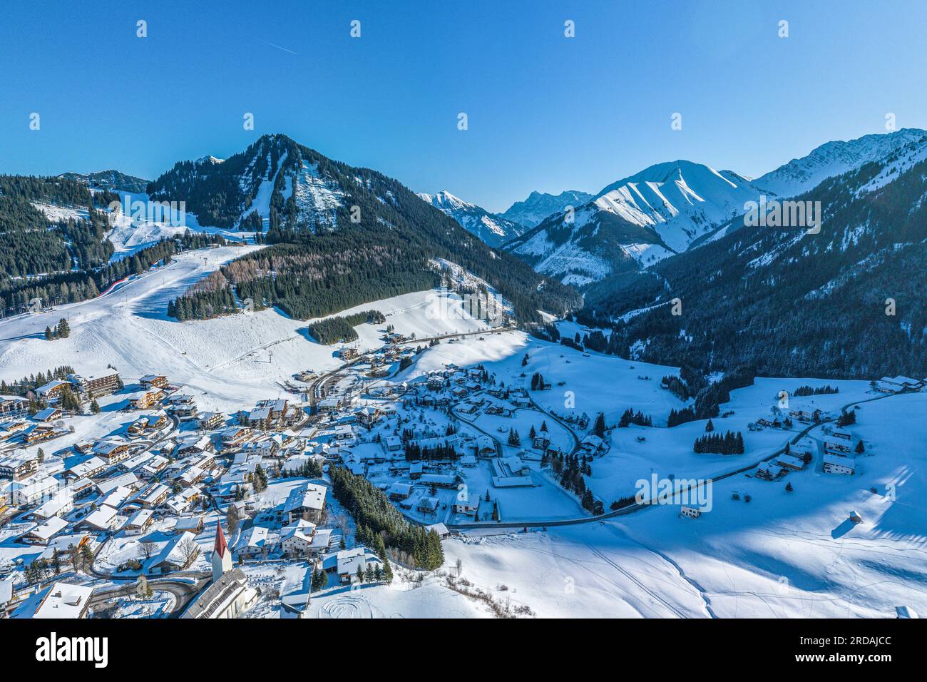 Aerial view to the wintry village Berwang in the touristic region ...