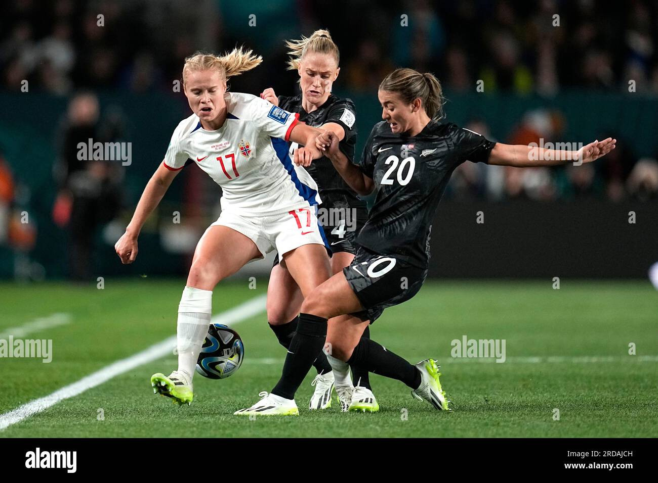 Norway's Julie Blakstad, left, competes for the ball with New Zealand's ...
