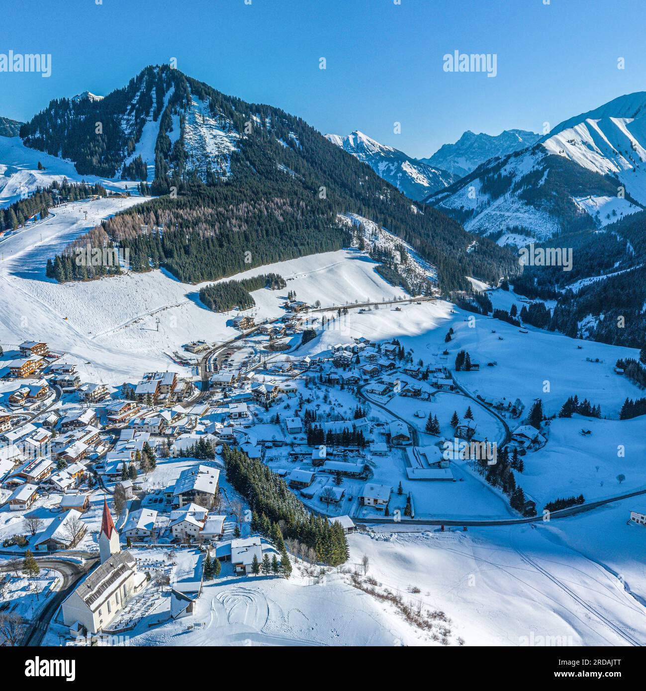 Aerial view to the wintry village Berwang in the touristic region ...