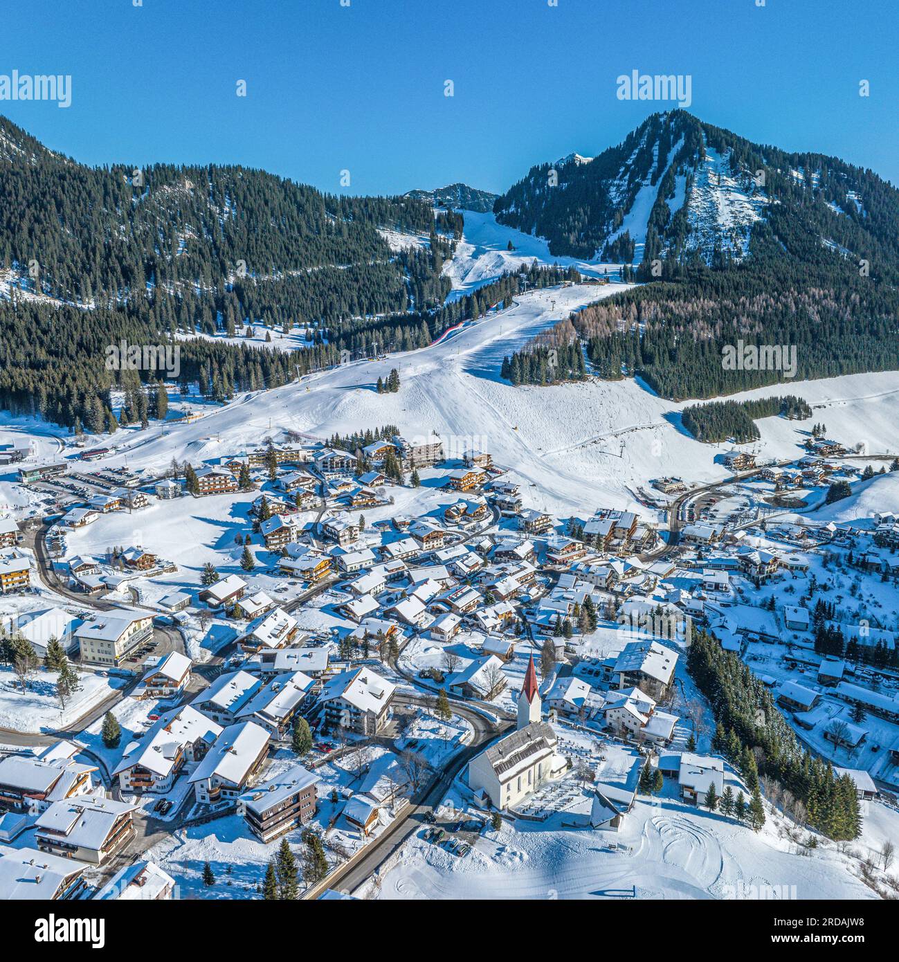 Aerial view to the wintry village Berwang in the touristic region ...