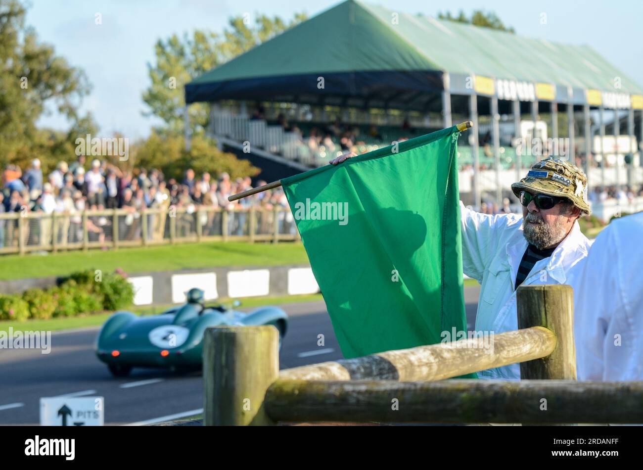 Green flag shown by a trackside marshal at the Goodwood Revival vintage ...