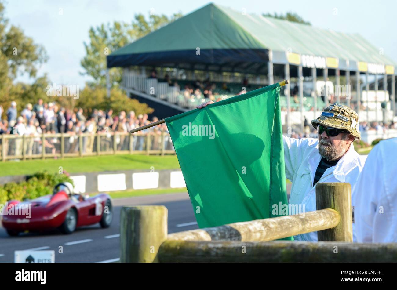 Green flag shown by a trackside marshal at the Goodwood Revival vintage ...