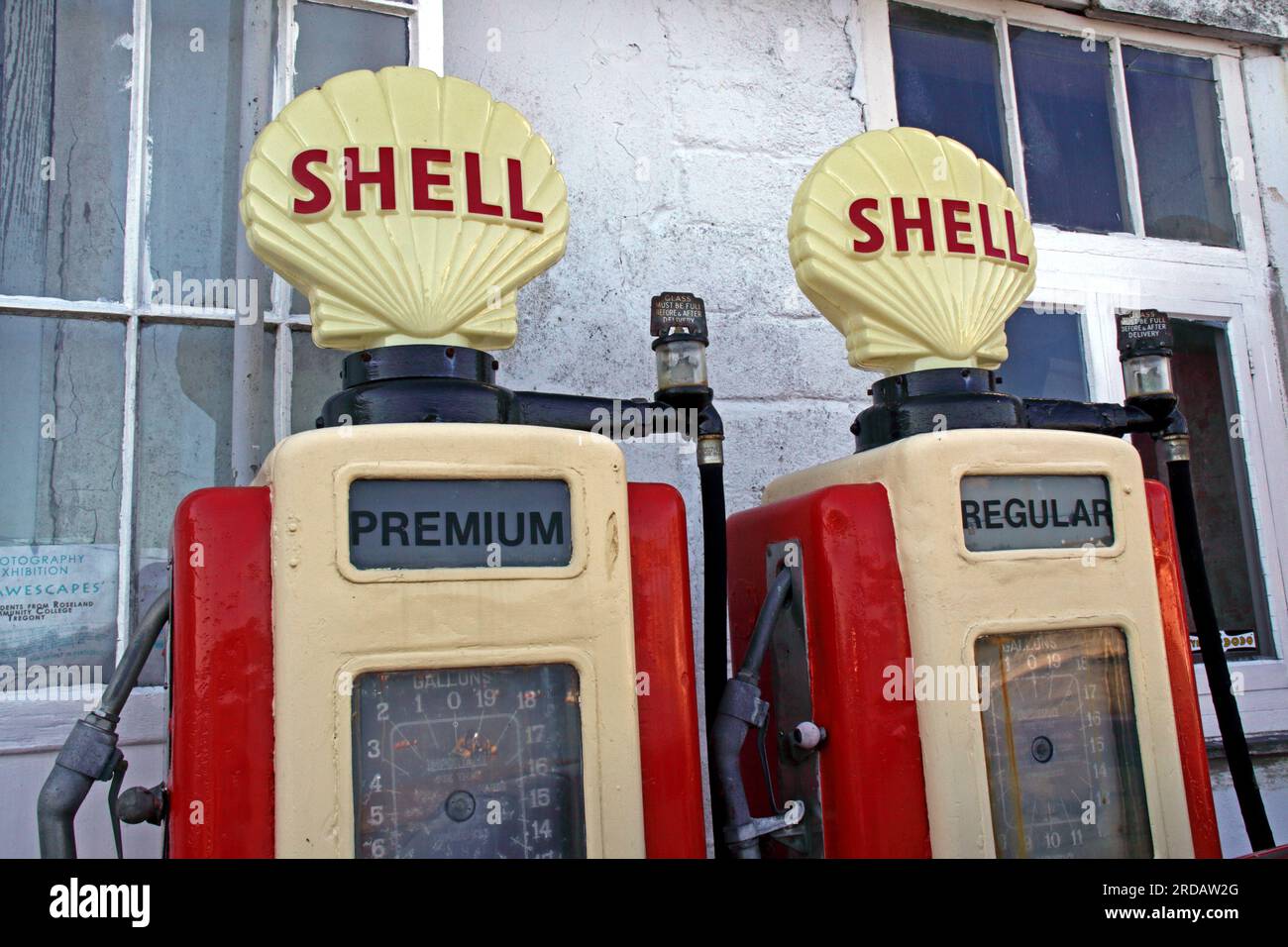 Antique vintage Shell petrol pumps, painted red on the harbourfront, St ...