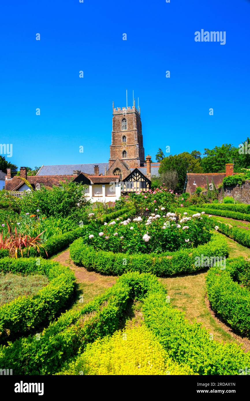 Dunster parish church of St George viewed from the Dream Garden at ...