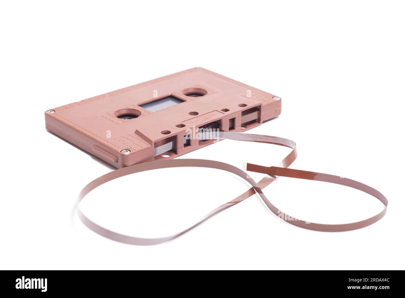 Audio cassette with pulled out audiotape isolated on white background ...