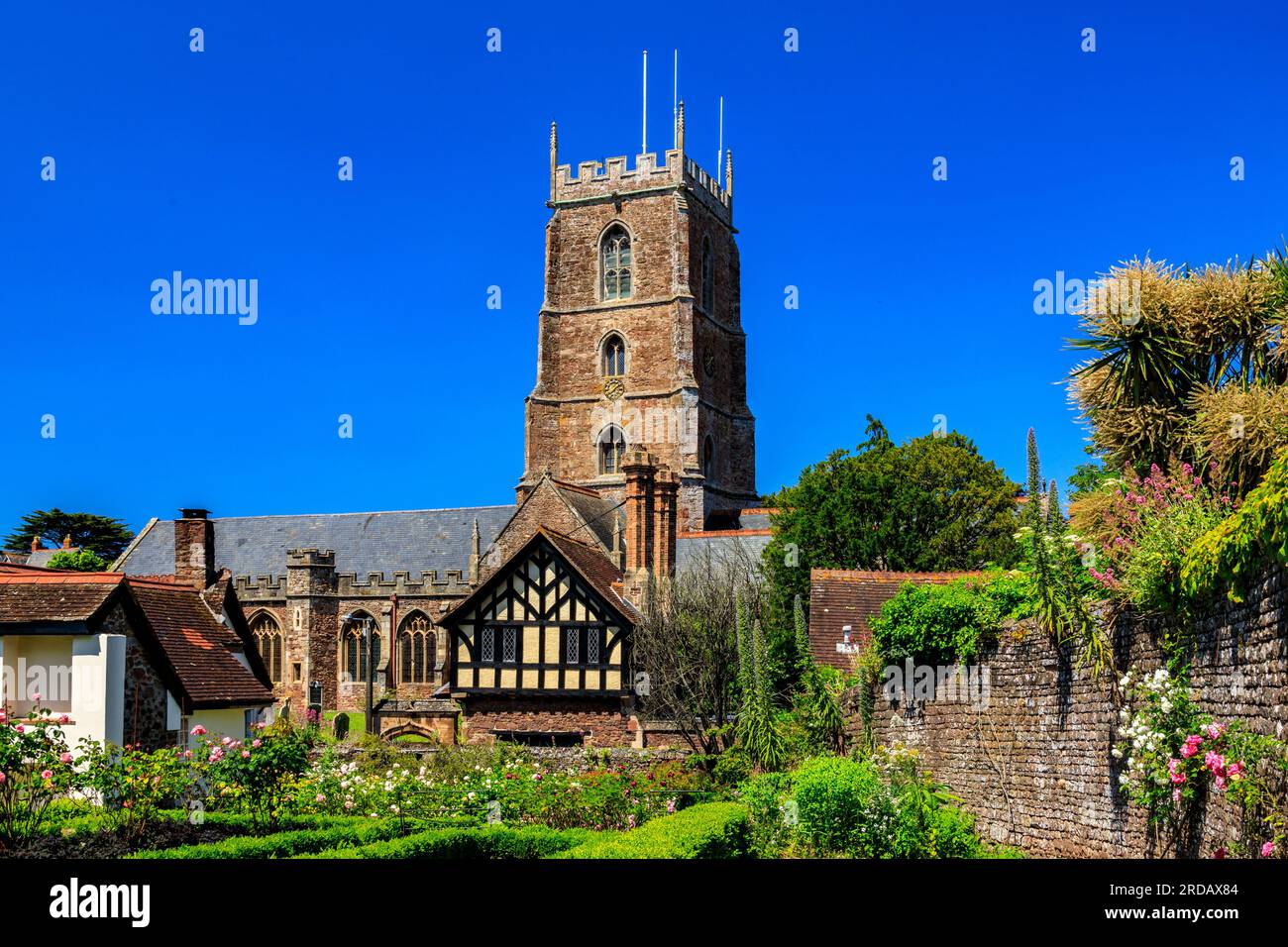 Dunster parish church of St George viewed from the Dream Garden at ...