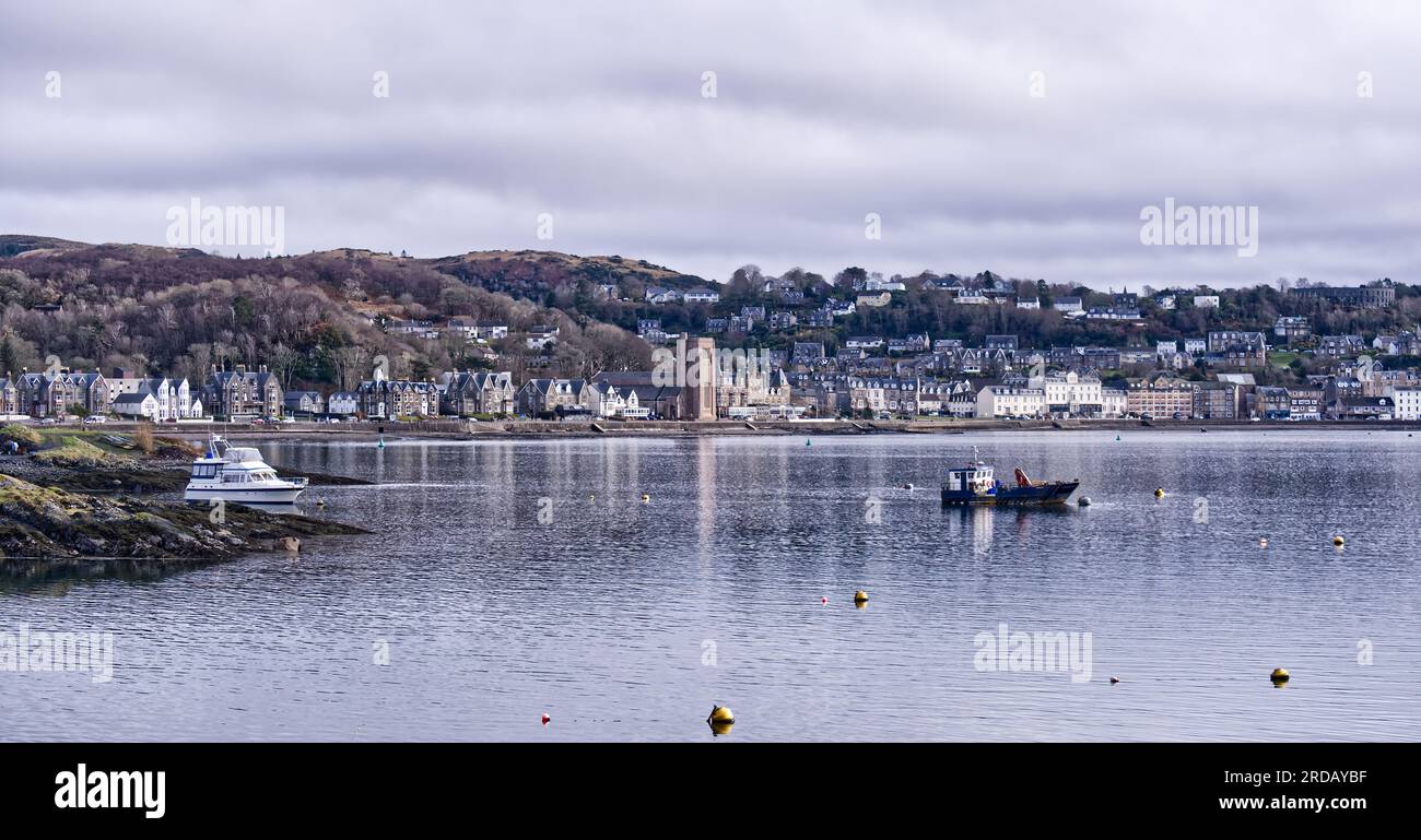 A shot of Oban, with town centre, north pier, esplanade and pontoons in ...