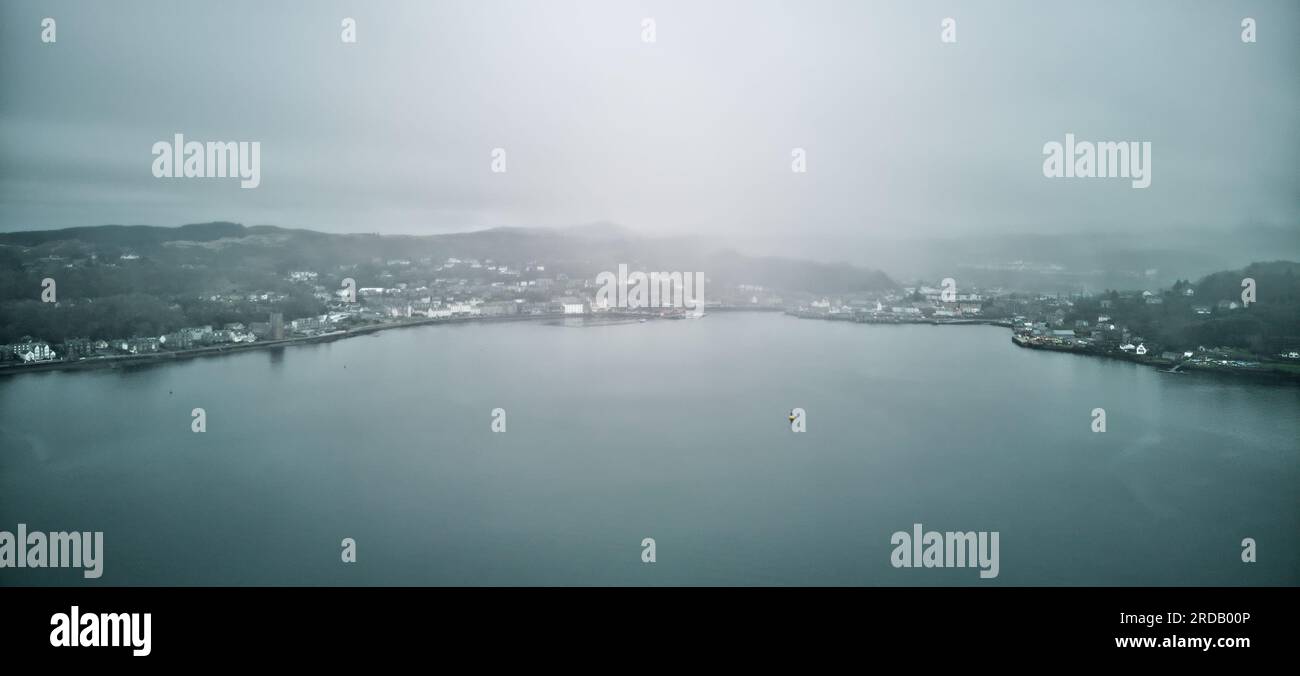 A drone shot of Oban, with town centre, north pier, esplanade, pontoons ...