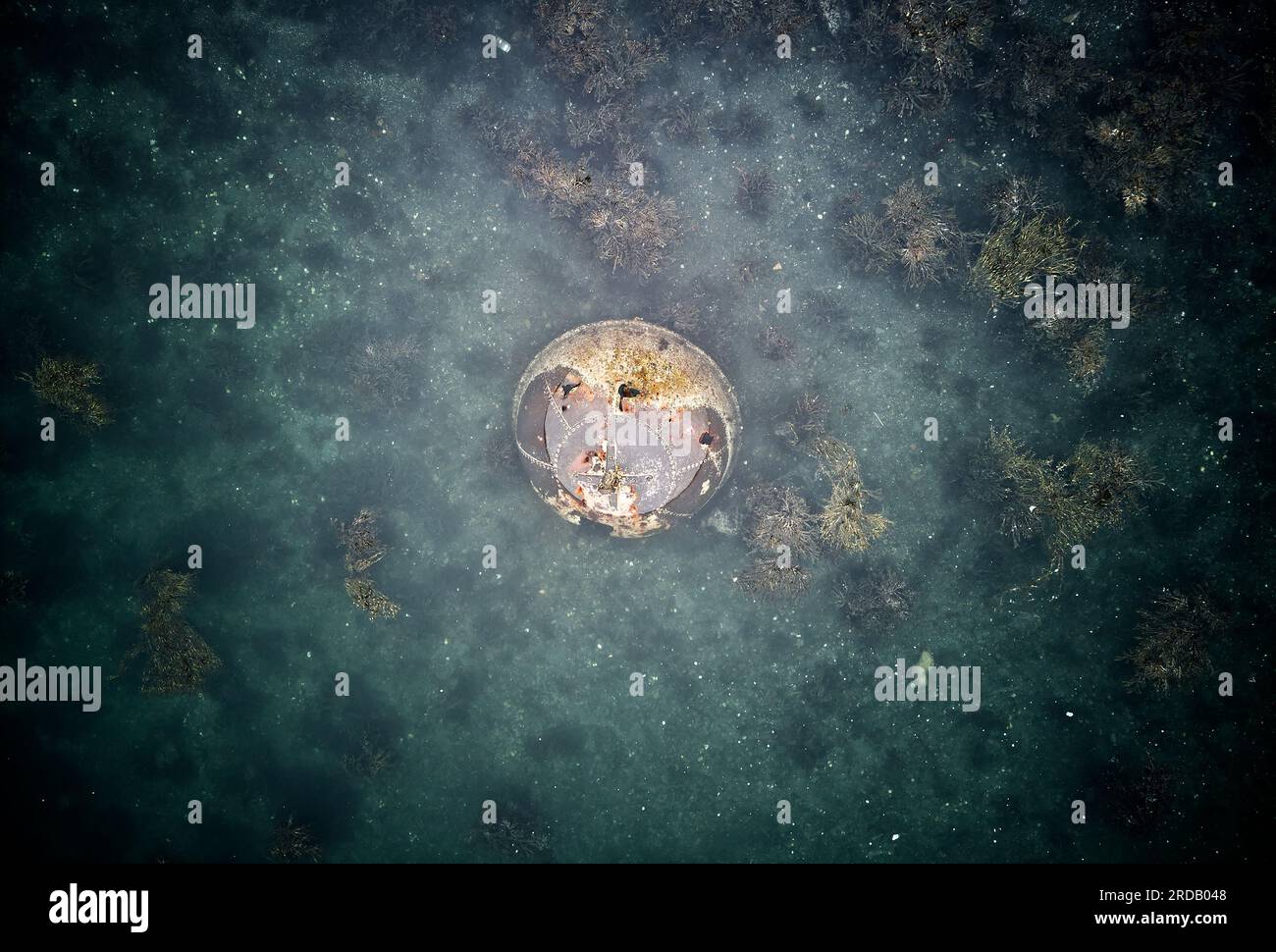 An old buoy lies in bad shape off the shore of Kerrera Stock Photo - Alamy