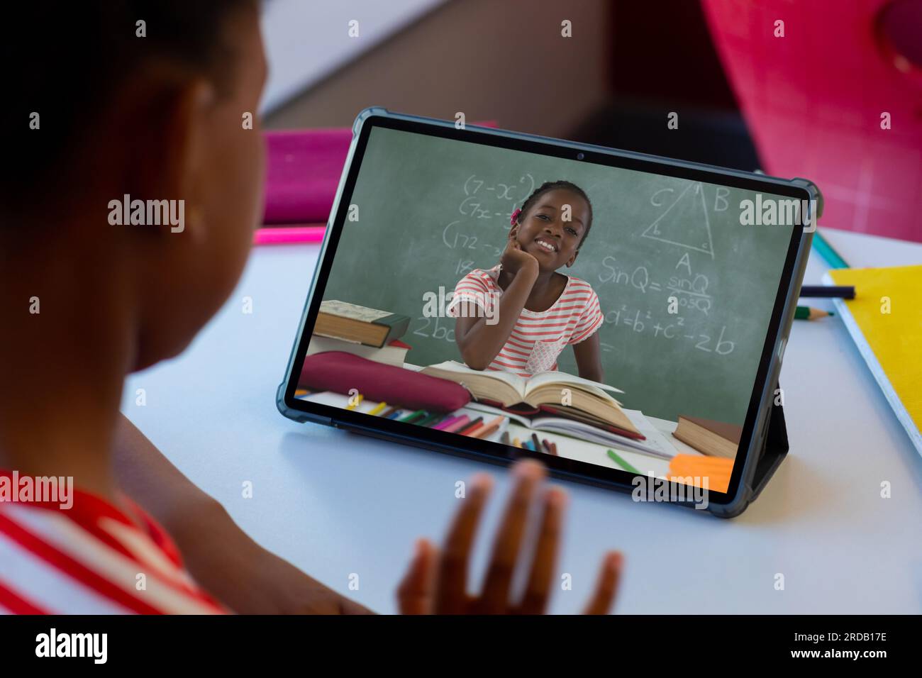 African american boy discussing mathematics homework with girl over ...