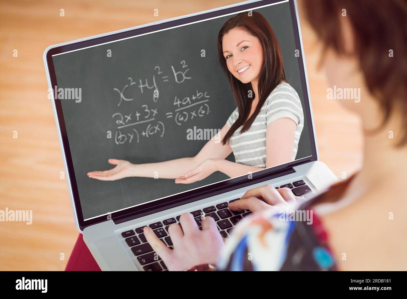 Caucasian woman looking at teacher teaching mathematics on laptop ...