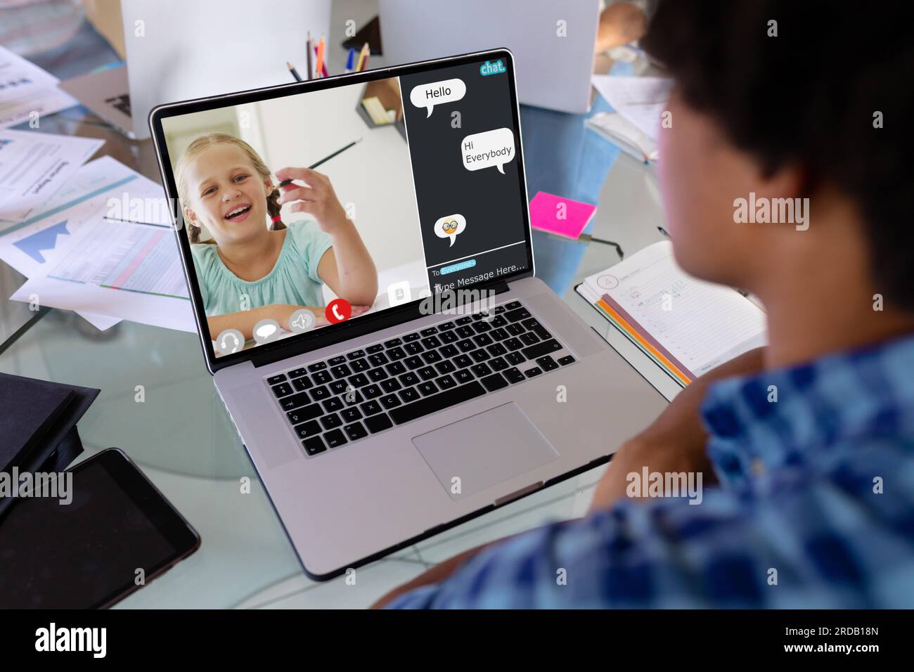 African american boy chatting and discussing homework with girl over ...