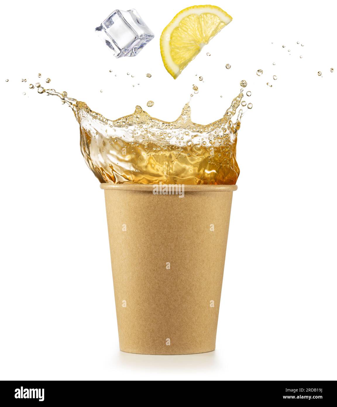 Flying lemon slice and ice cube falling into splashing iced tea in ...