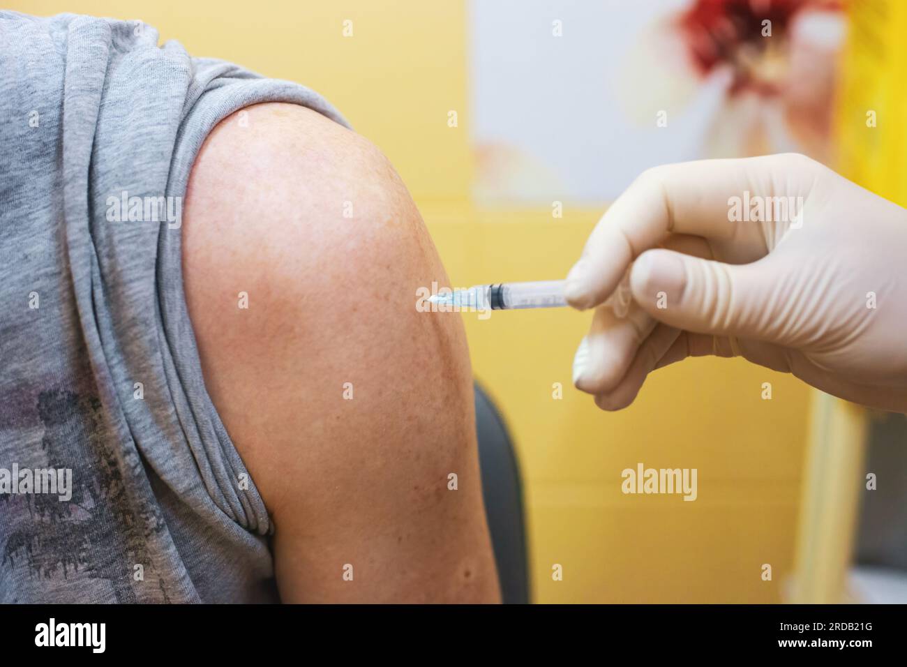 Doctor make patient flu injection in clinic office. Nurse in surgical ...