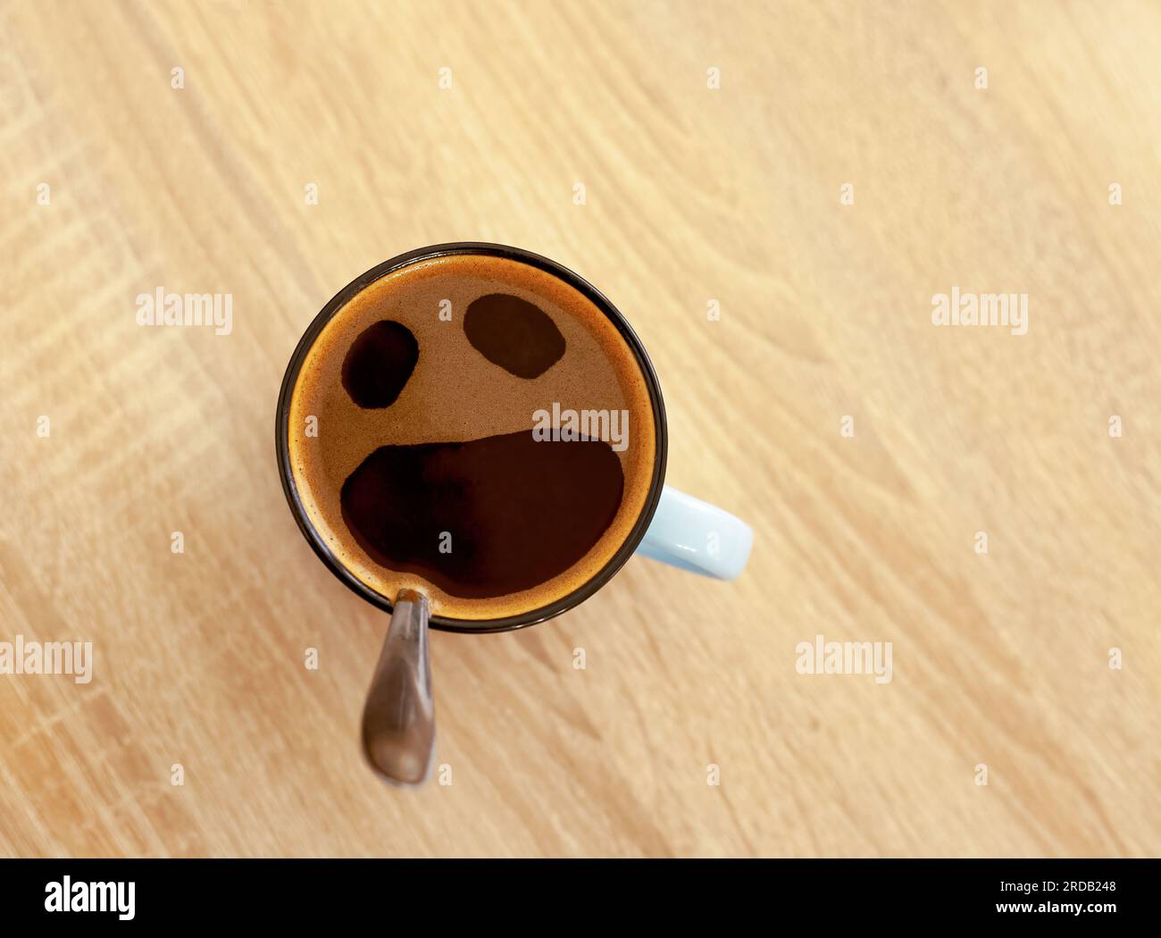 Coffee cup with funny screaming in fear face, top view. Open crying ...