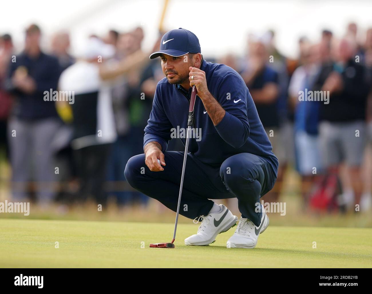 Australia's Jason Day lines up a putt during day one of The Open at ...