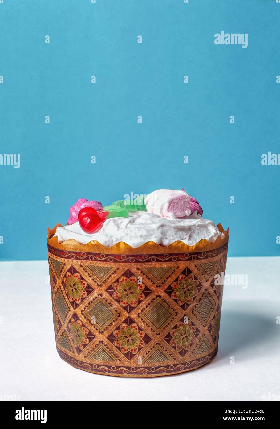 Homemade Kulich on blue background. Baked Easter cake decorated with ...