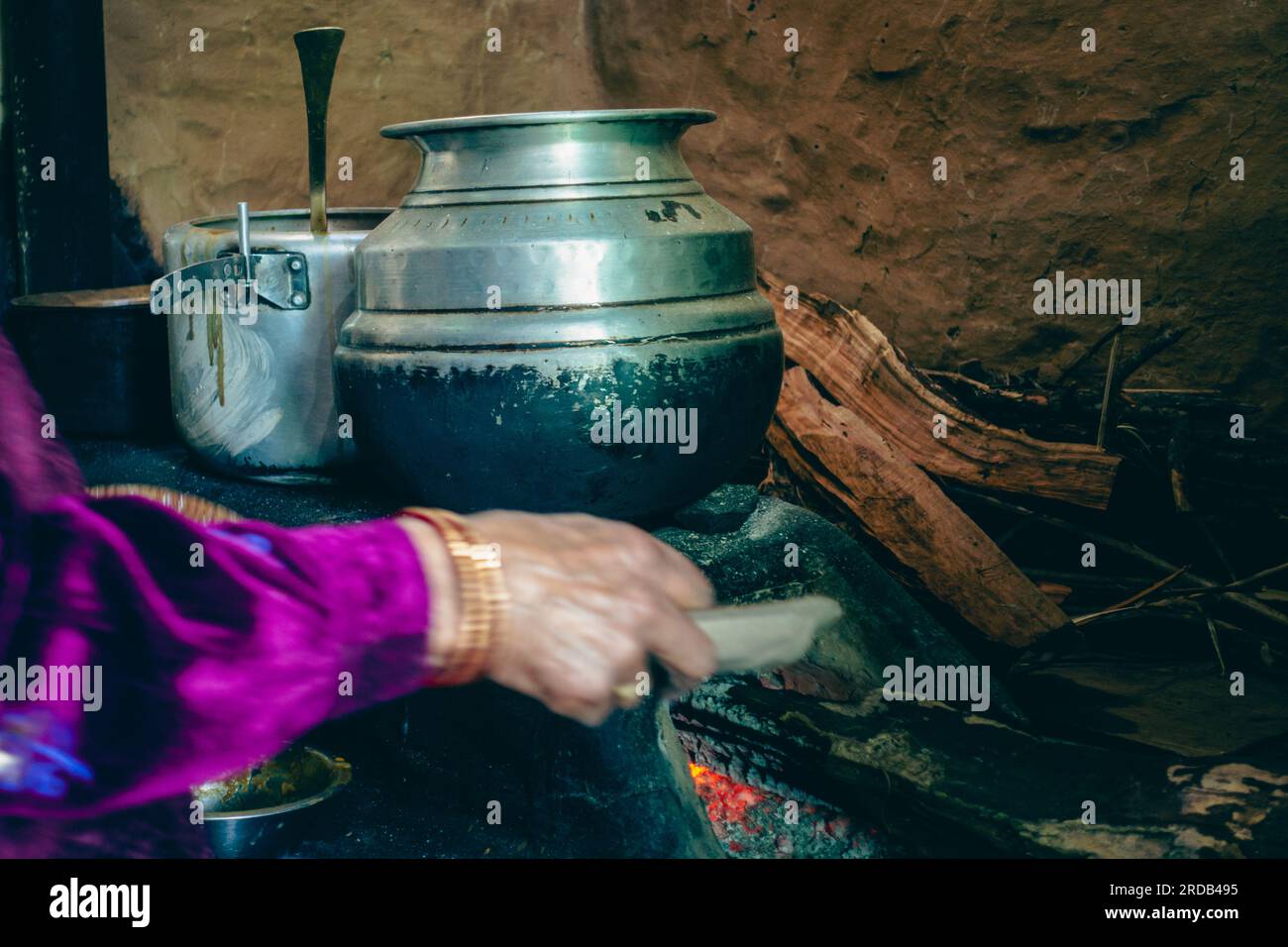 An old vintage vessel over a clay fireplace called chulha in India ...