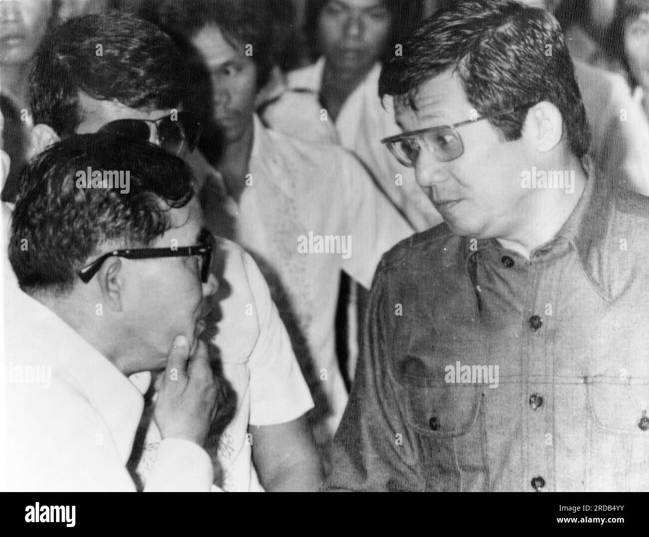 Former senator Benigno S. Aquino Jr, right, confers with former senator ...