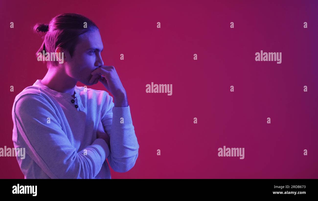 Pensive guy neon light people puzzled man thinking Stock Photo - Alamy