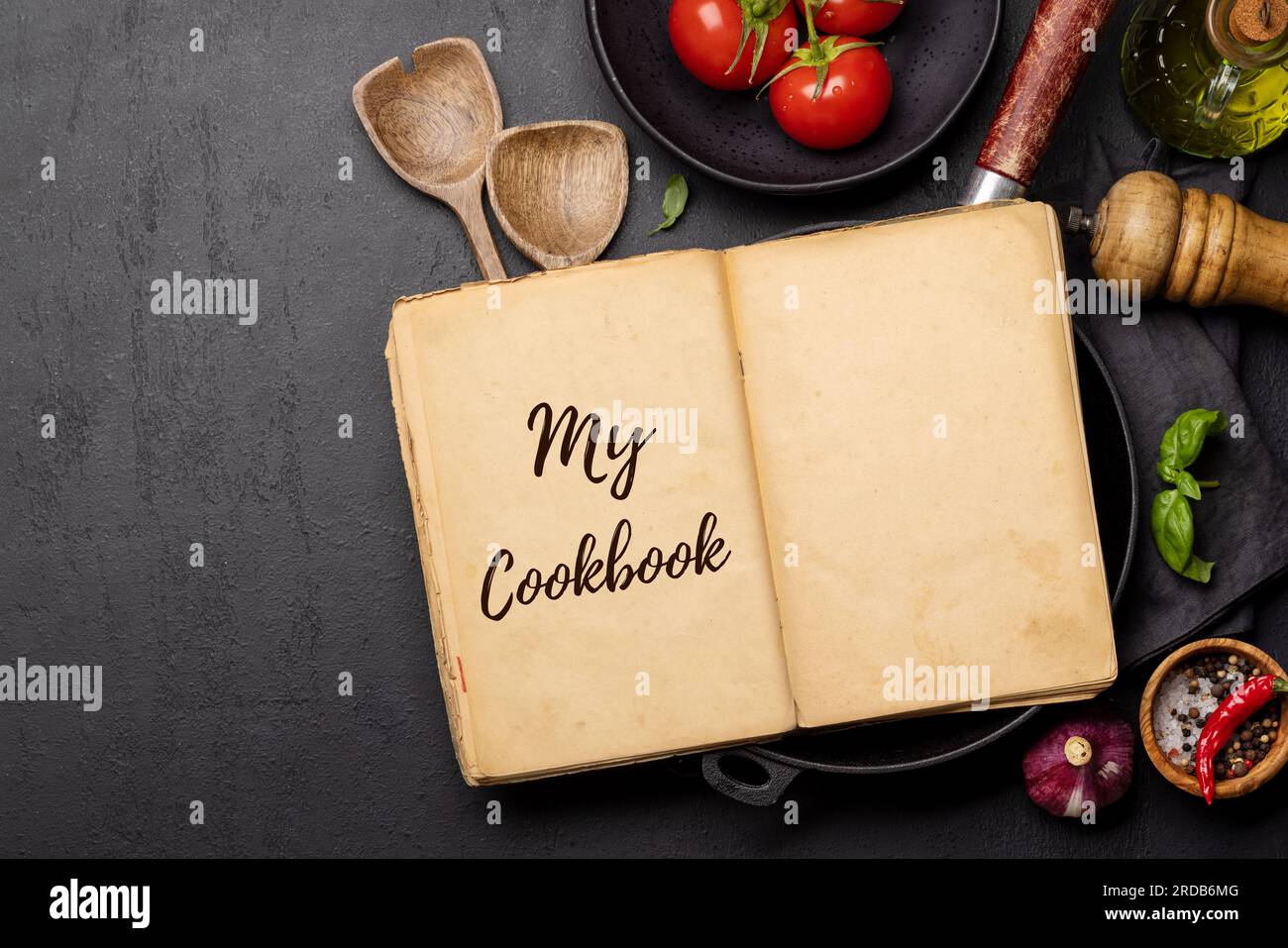 Top-down view of a kitchen table with ingredients, utensils, and an ...