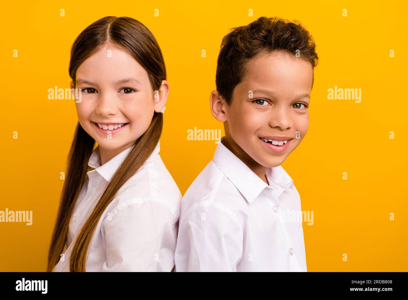 Photo of cheerful sweet preteen schoolchildren wear white shirts ...