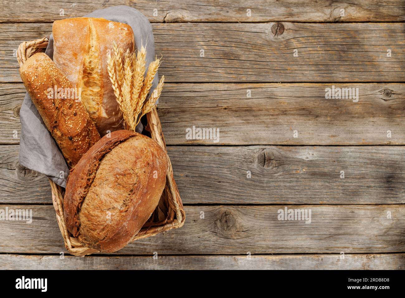Assorted bread varieties in a charming basket, ready to be enjoyed ...