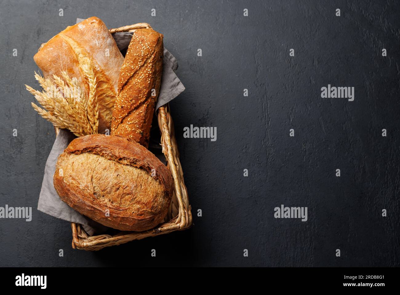 Assorted bread varieties in a charming basket, ready to be enjoyed ...