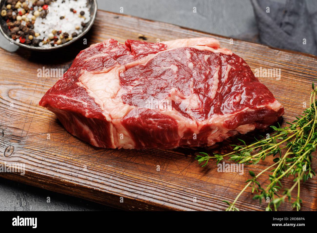 Raw beef ribeye steak, fresh and ready for cooking, promising a ...