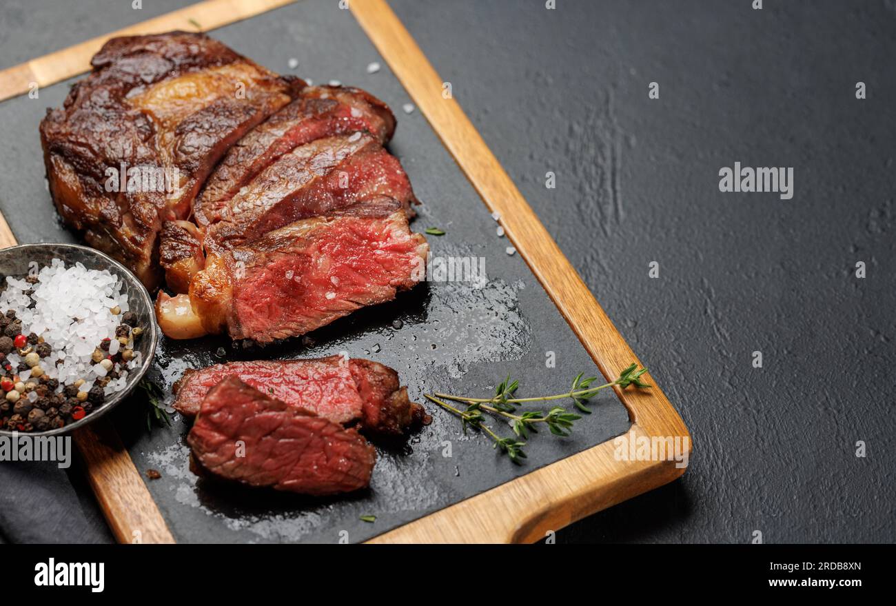 Deliciously juicy sliced beef ribeye steak, perfectly cooked and ready ...