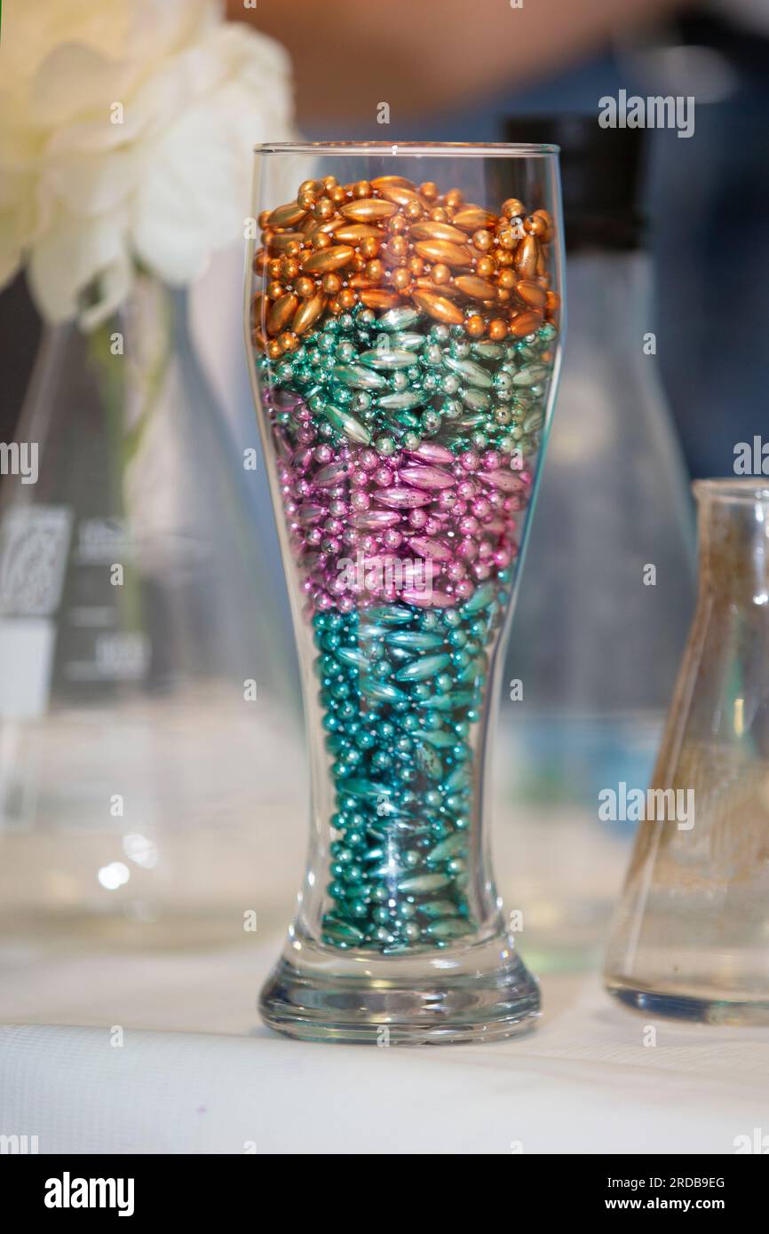 Multi-colored beads for laboratory experiments in a glass beaker Stock ...