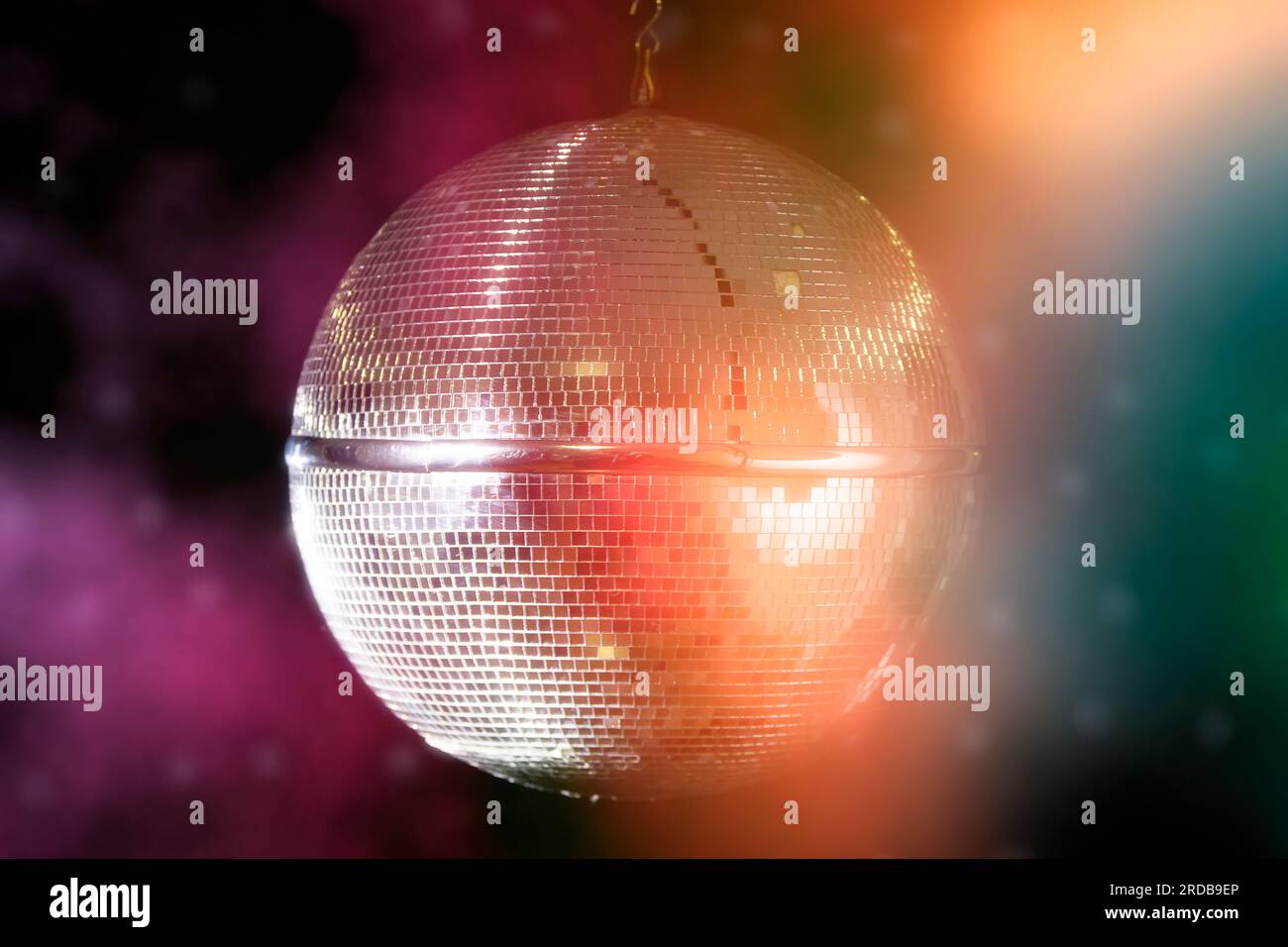 Disco ball with bright beams, night party background photo Stock Photo ...