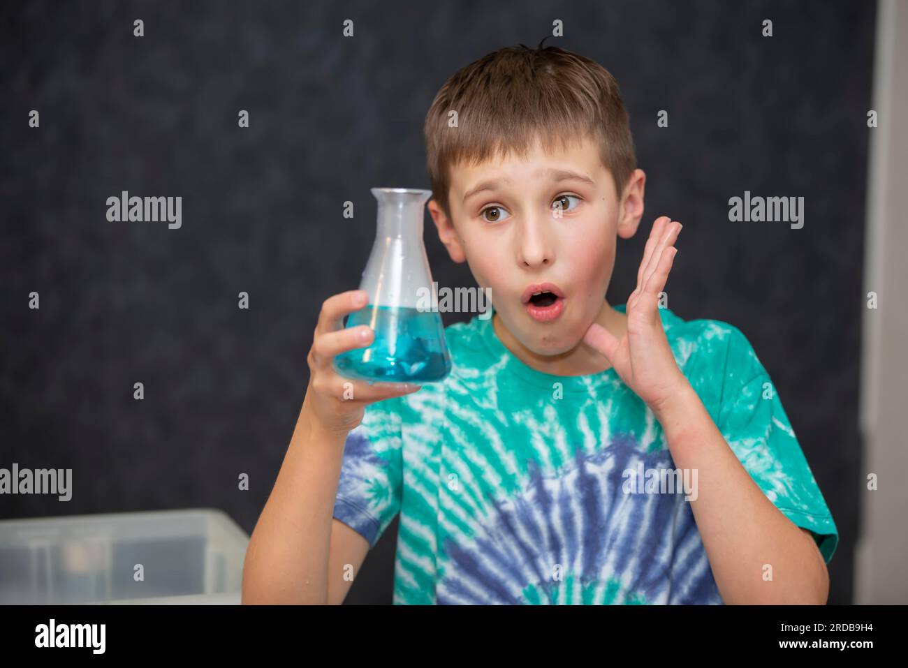 New scientific discoveries. Smart boy scientist screaming in surprise ...