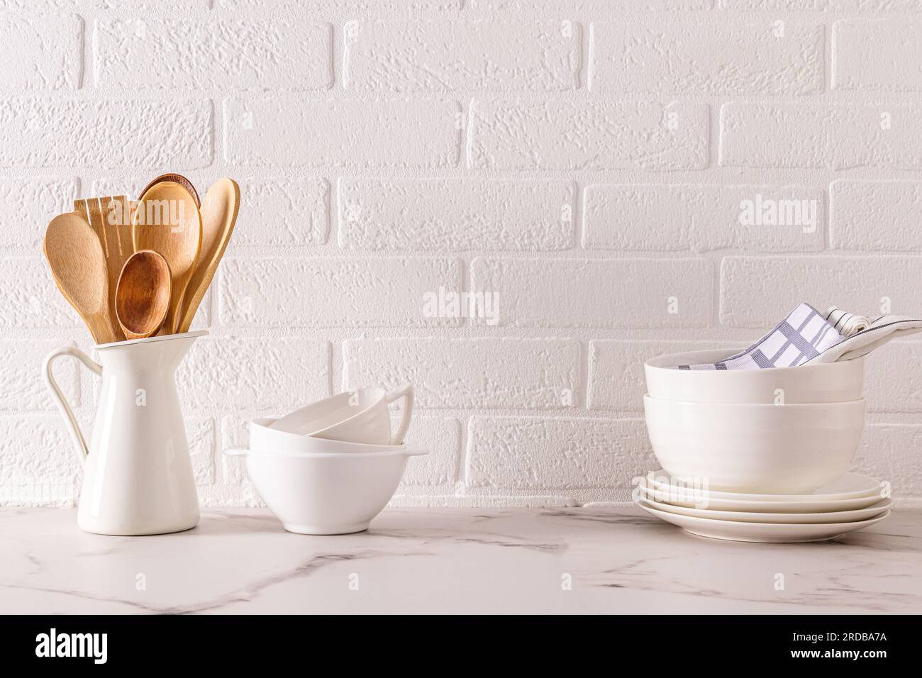 Kitchen background in minimalist white style. Beautiful white dishes on ...