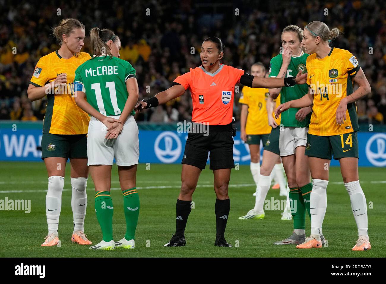 Referee Edina Alves Batista talks to Ireland's Katie McCabe and ...