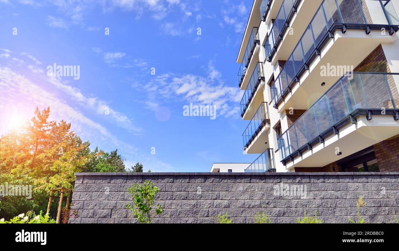 A modern residential building in the vicinity of trees. Ecology and ...