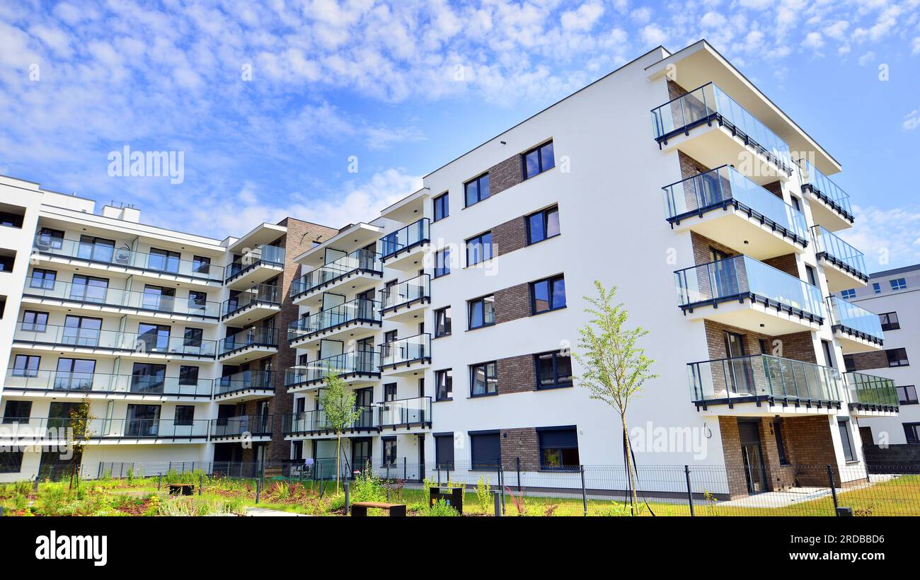 A modern residential building in the vicinity of trees. Ecology and ...