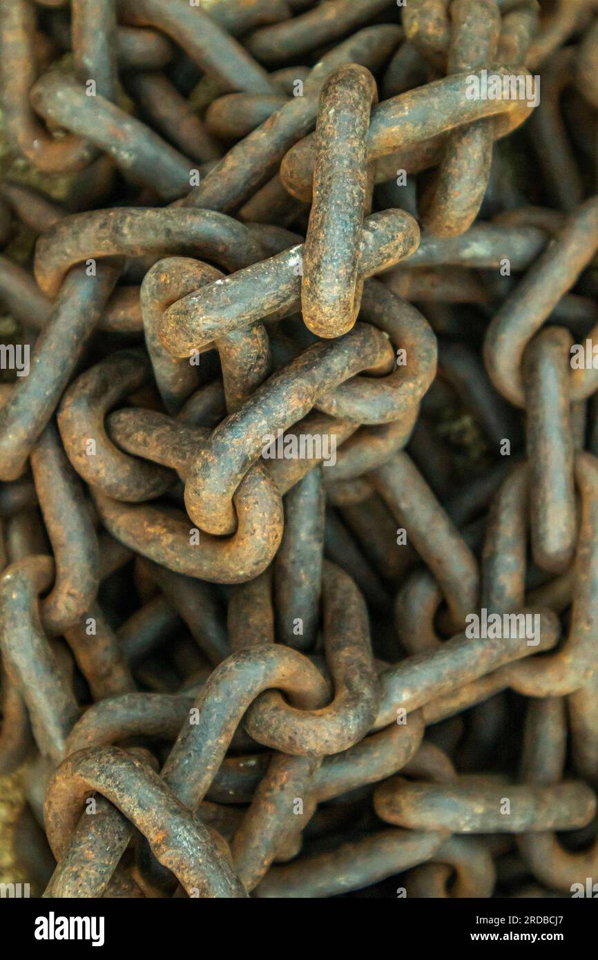 Rusty chain on the ground, close up of photo Stock Photo - Alamy