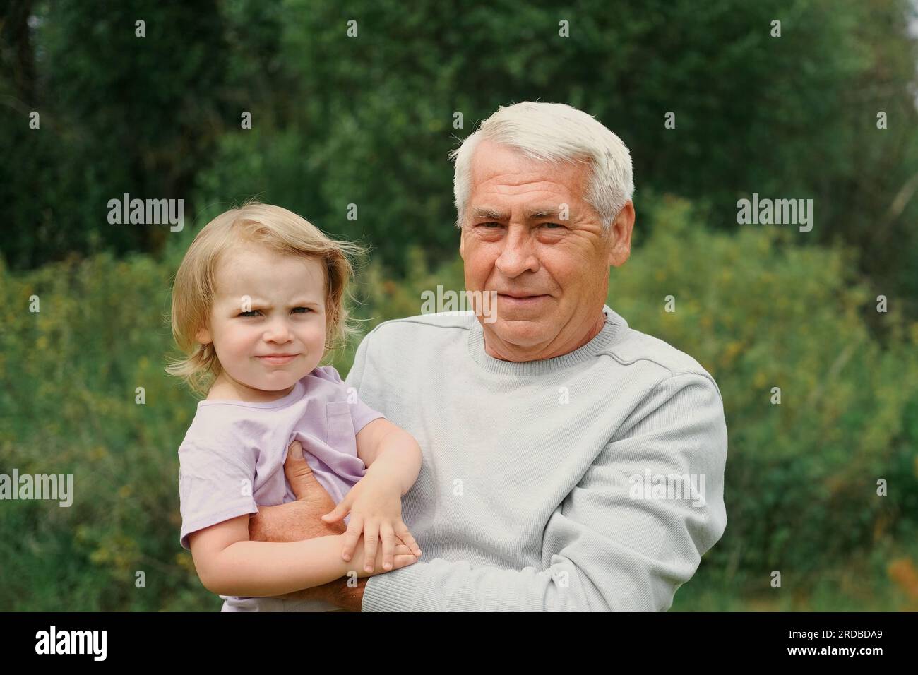 Grandfather and grandchild baby have fun during walk In Park. Happy ...