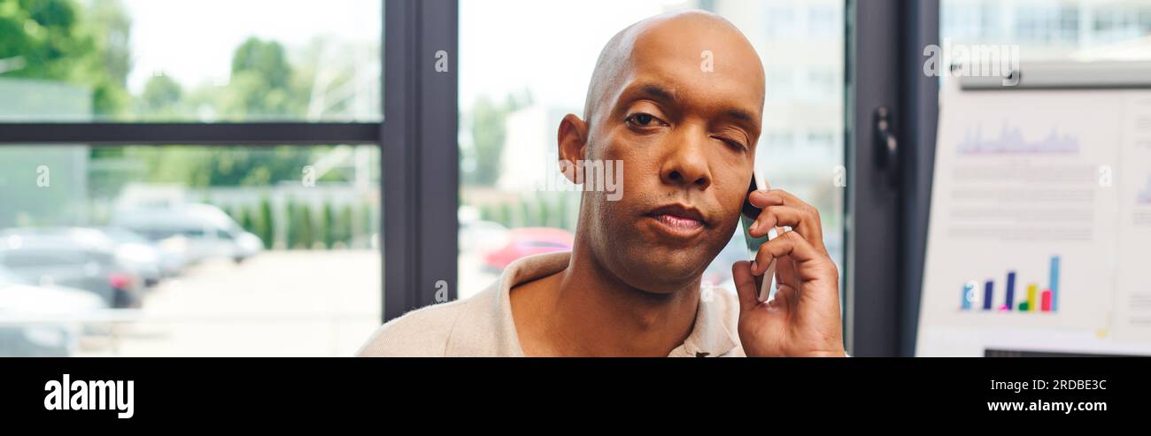 myasthenia gravis, african american man with eye syndrome having phone ...