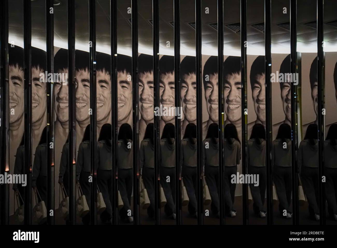 The posters of Bruce Lee are reflected on mirrors in the exhibition ...