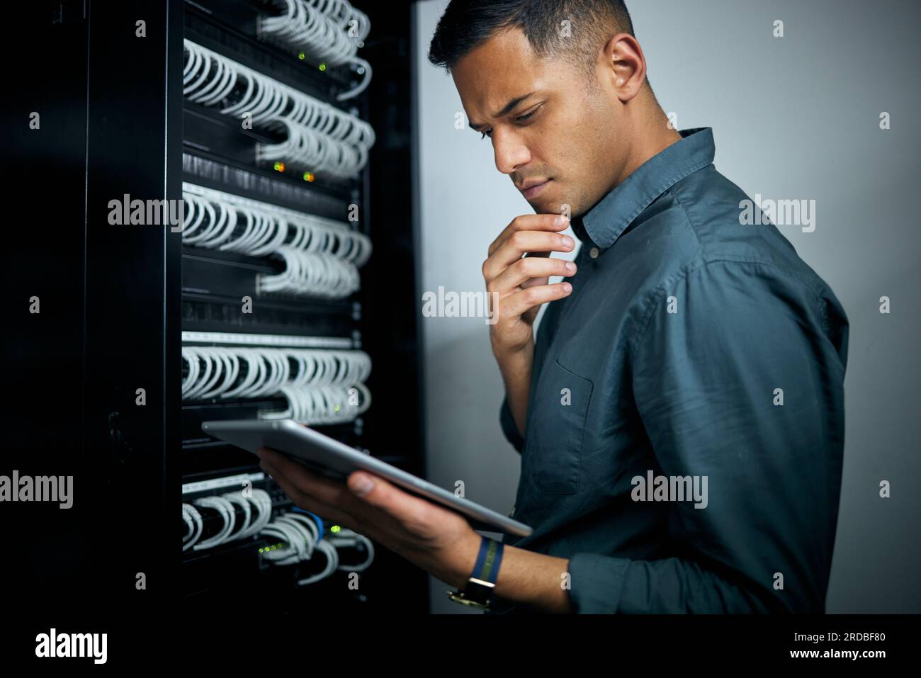 Engineer Man Tablet And Thinking In Server Room Inspection Coding And Check For Analysis