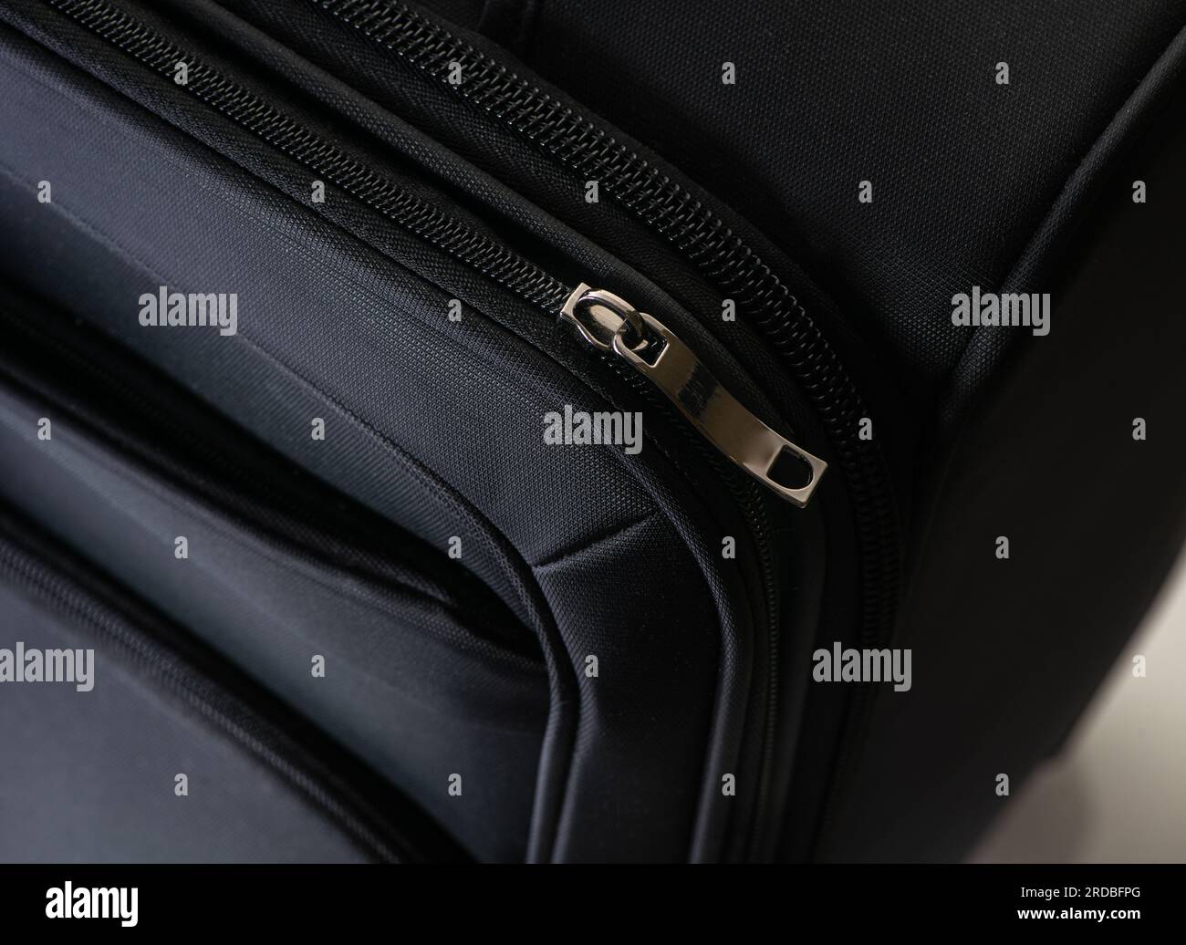 Close-up of black suitcase zipper Stock Photo - Alamy