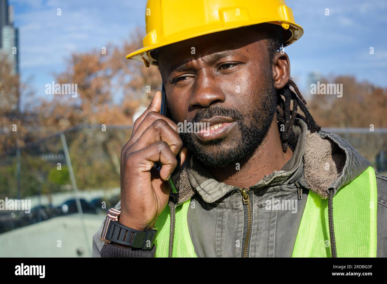 closeup of young african ethnicity man civil engineer, employee at ...